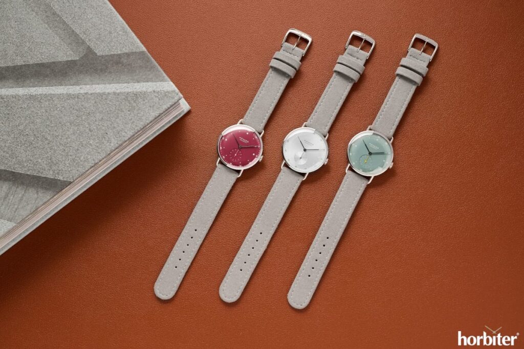 The Nomos Metro 33 All Silver, Muted Red and Sage watches