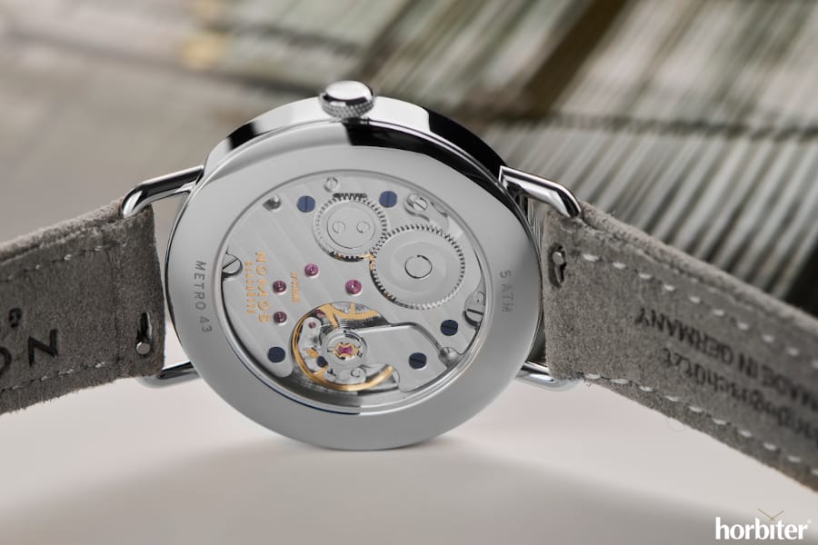 The Nomos Metro 33 All Silver, Muted Red and Sage watches