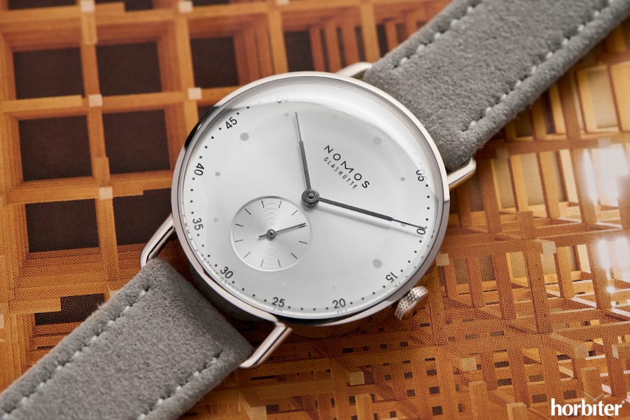 The Nomos Metro 33 All Silver, Muted Red and Sage watches